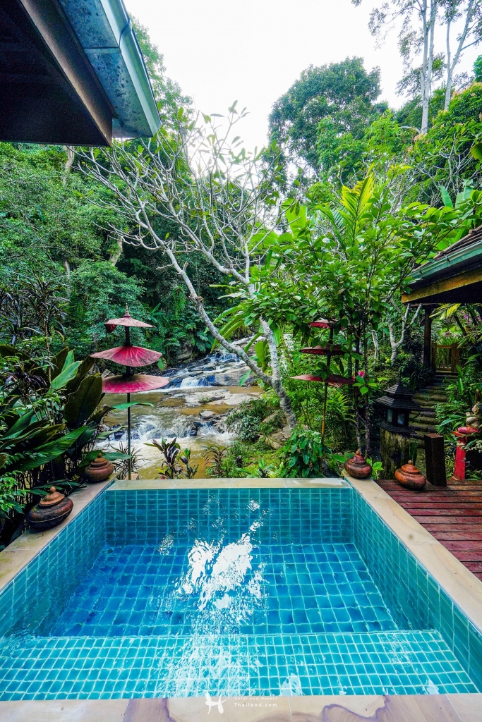 The lobby of the resort offers a view of the waterfall, and in fact ...