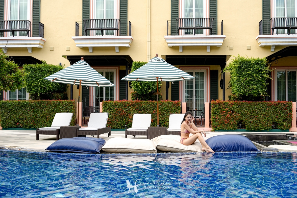 The pool bar serves a variety of drinks. You should order some to ...